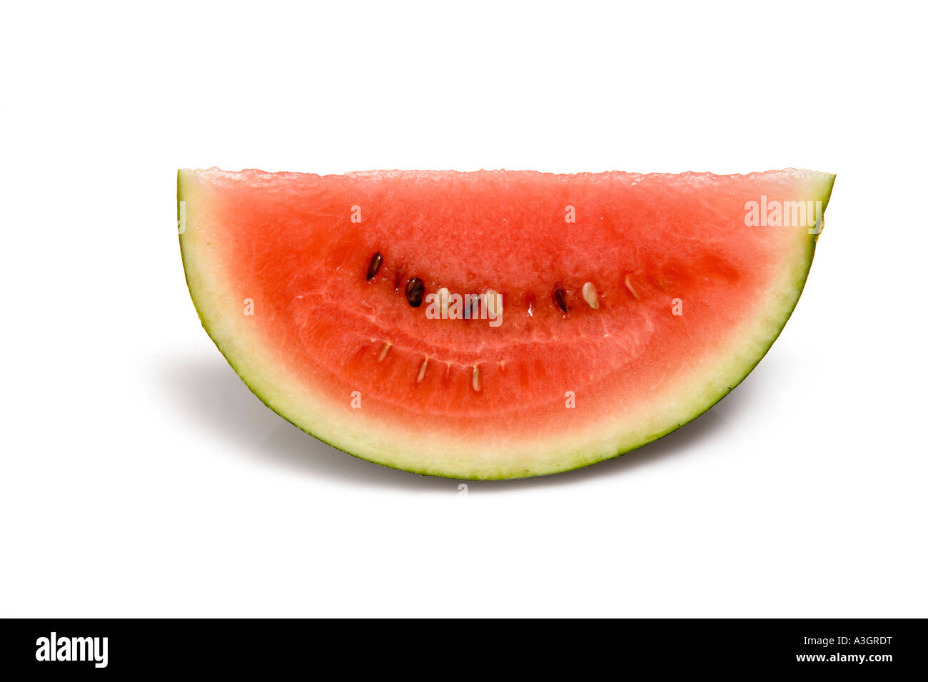 Watermelon slice isolated on a white studio background Stock Photo - Alamy