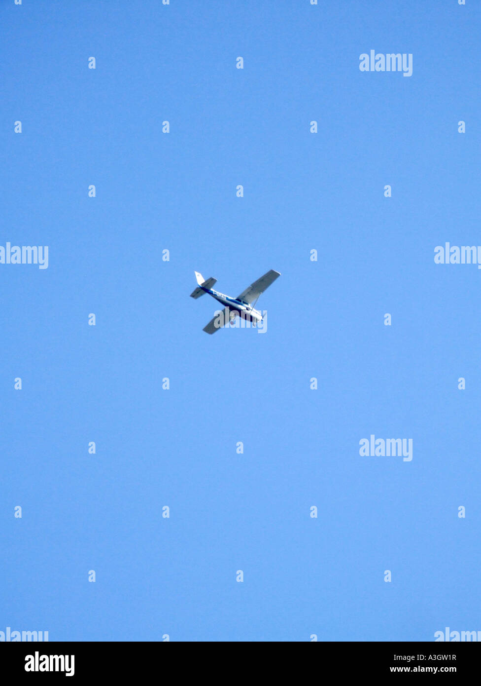 light plane moving across sky Stock Photo - Alamy
