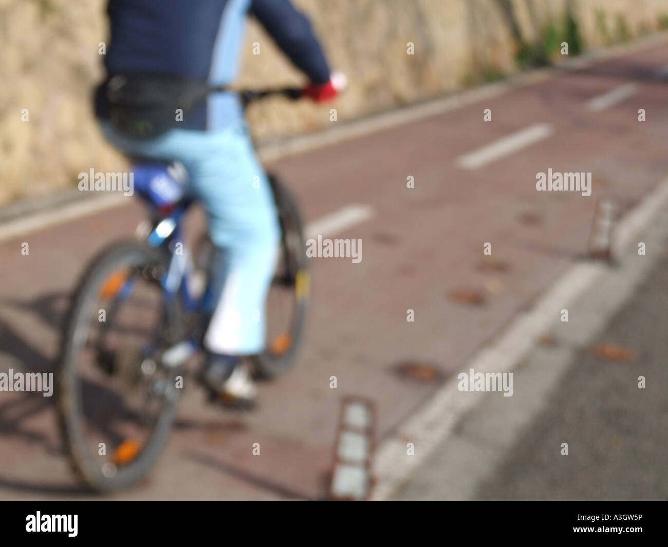 man on bike on cycle path Stock Photo - Alamy