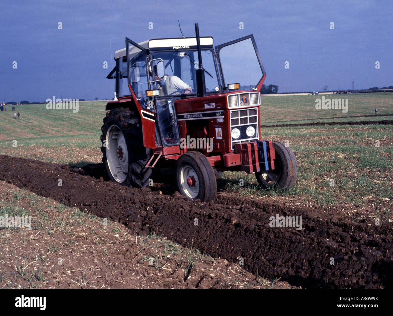 Vintage tractor ploughing straight furrows in contest Stock Photo - Alamy