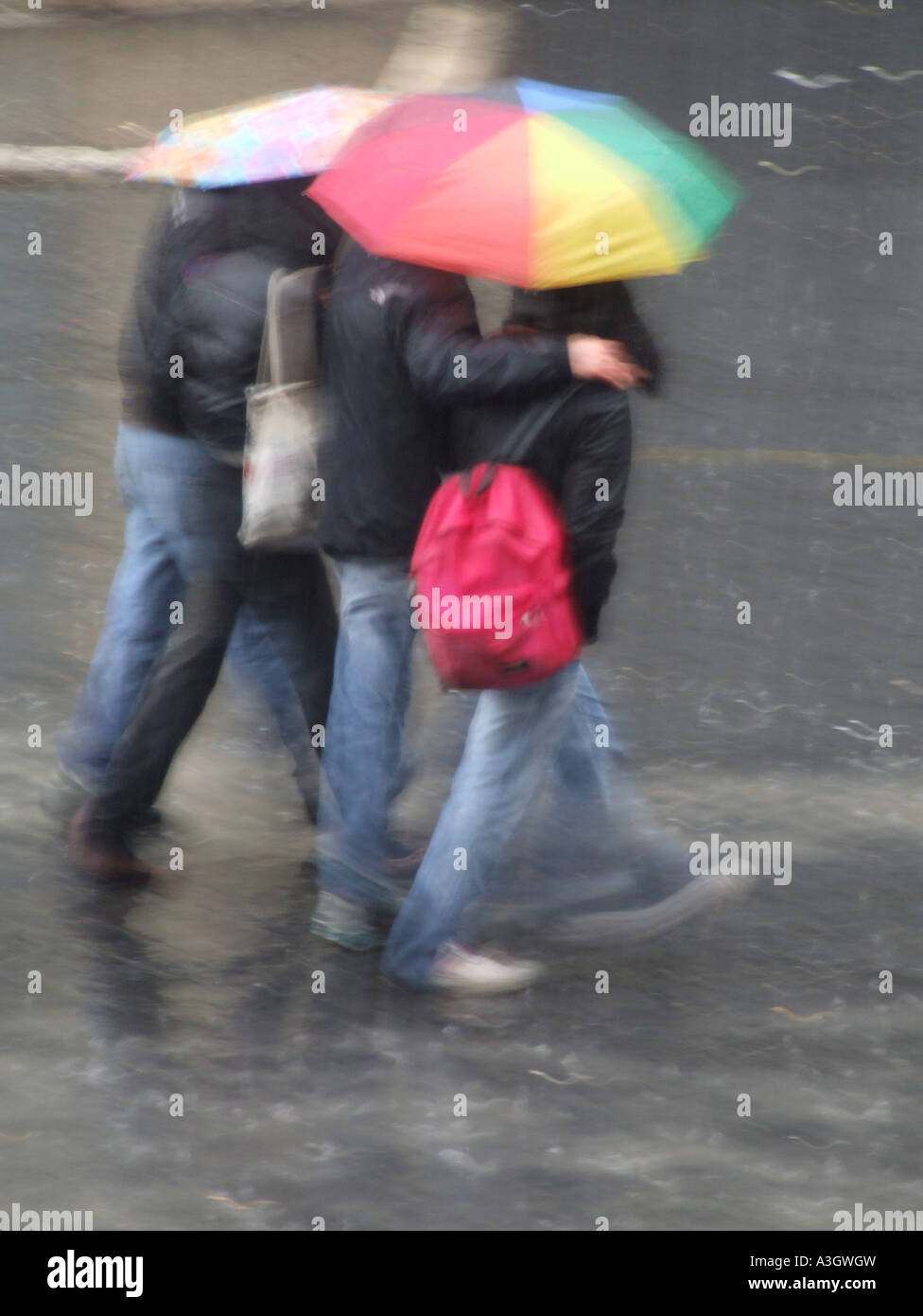 people carrying umbrella in town Stock Photo - Alamy