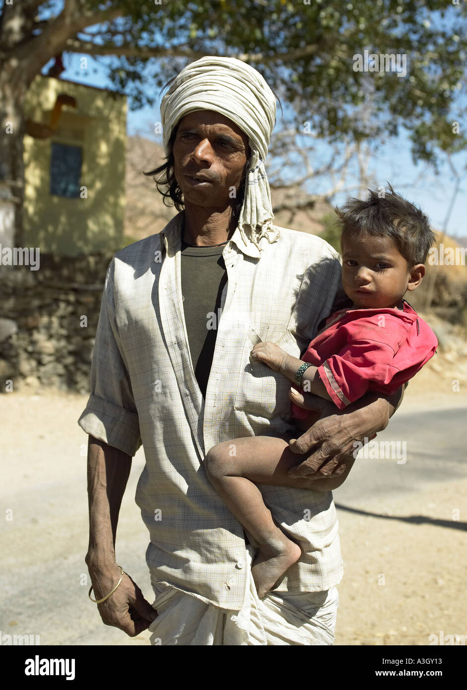 Indian man and child in Rajasthan, India Stock Photo - Alamy