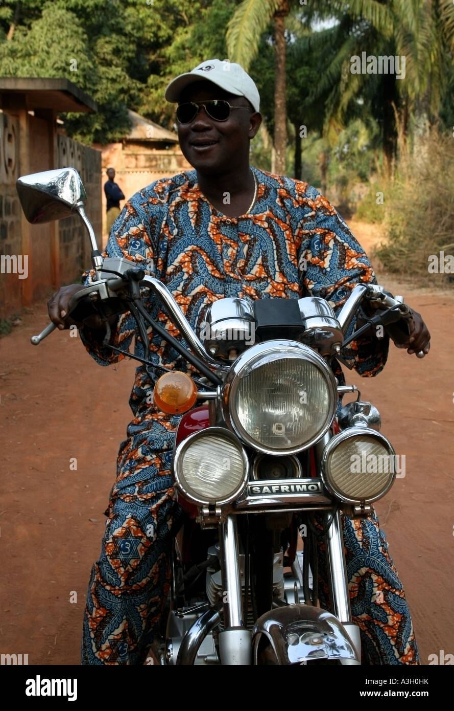 Benin man on his motorbike , Abomey Stock Photo - Alamy