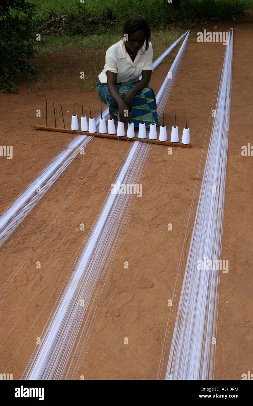 Lady preparing thread for weaving on a loom , Abomey , Benin Stock ...