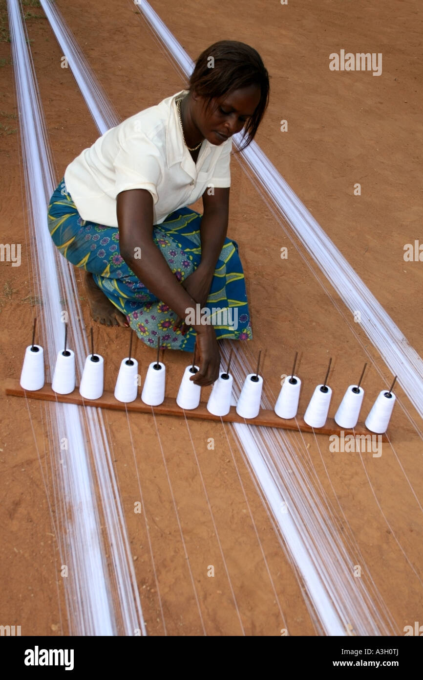 Lady preparing thread for weaving on a loom , Abomey , Benin Stock ...