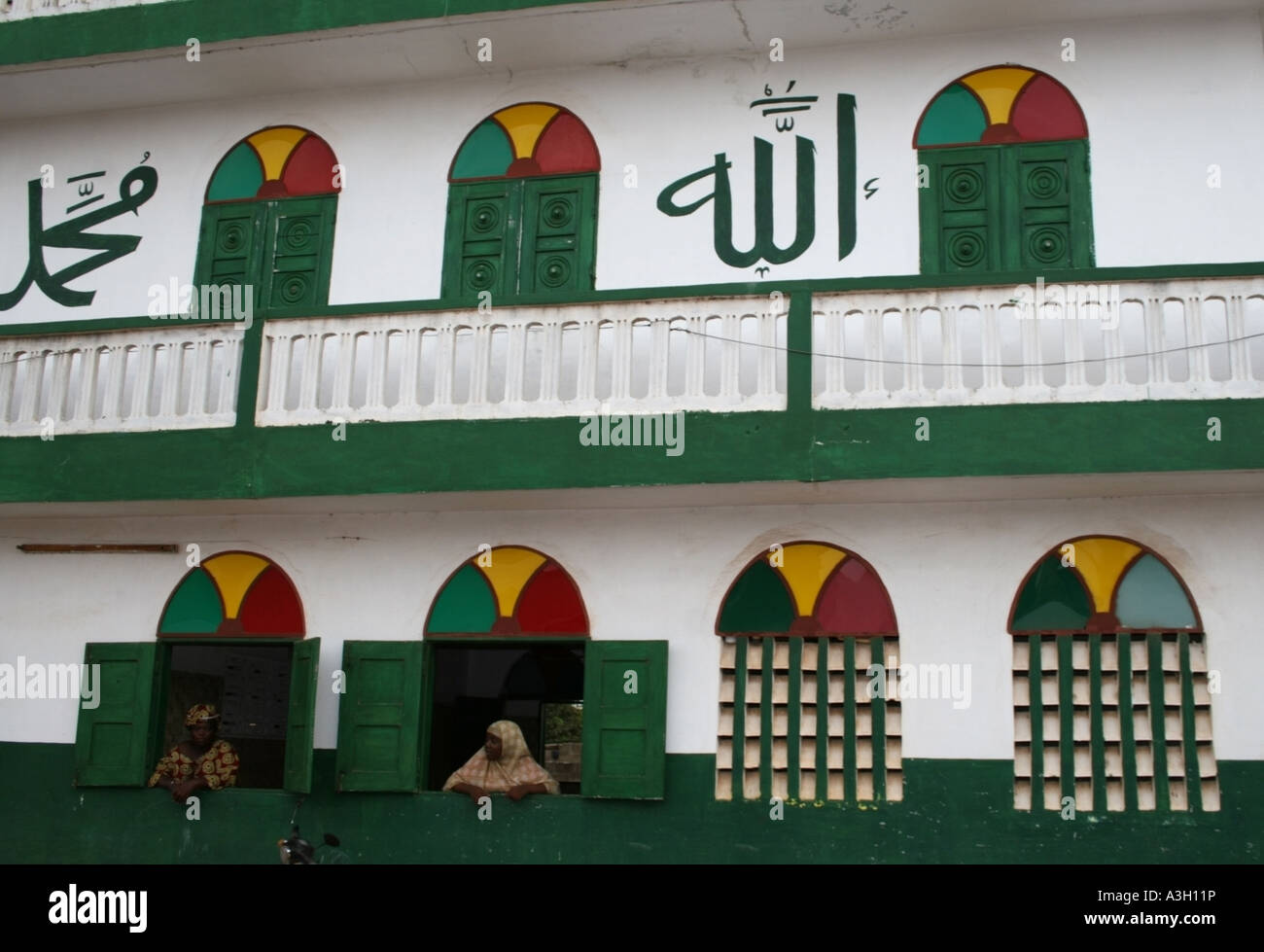 Simple arched stain glass windows and Arabic script with the words ...