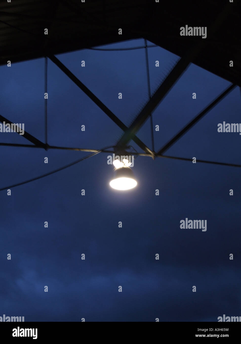 one light on roof at night Stock Photo - Alamy