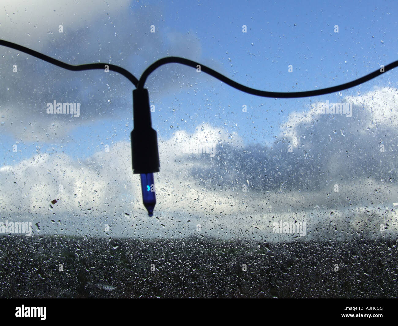 fairy light and wet window Stock Photo - Alamy