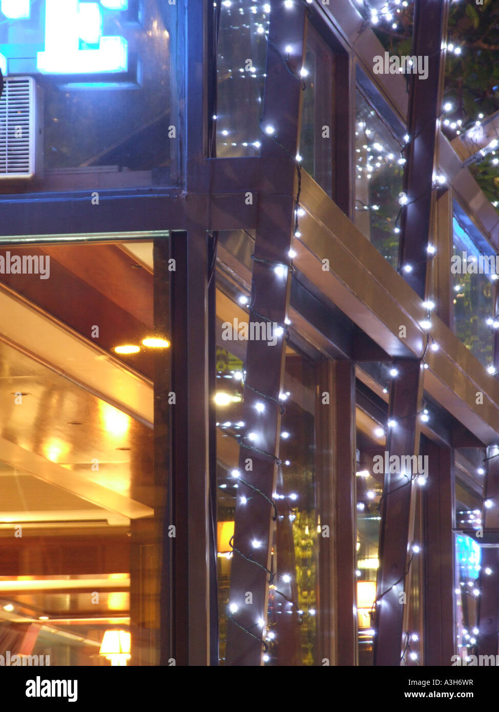 blue lights hanging outside restaurant at night Stock Photo - Alamy