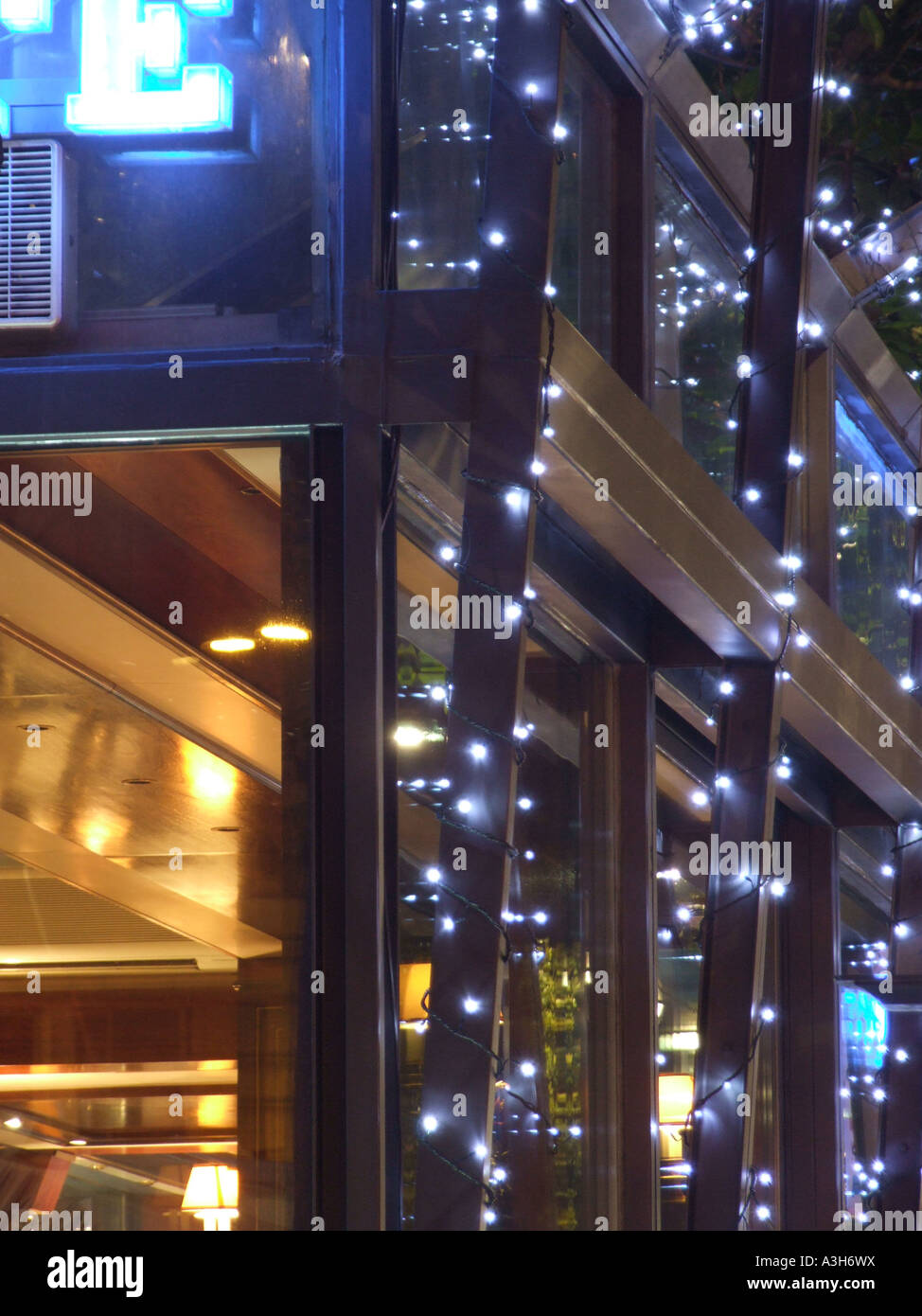 blue lights hanging outside restaurant at night Stock Photo - Alamy