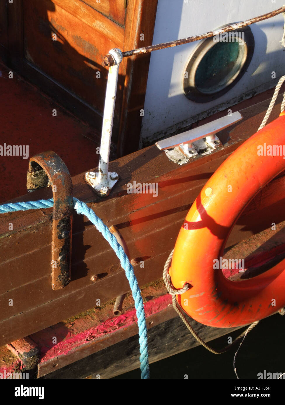 rubber ring on old style boat Stock Photo - Alamy