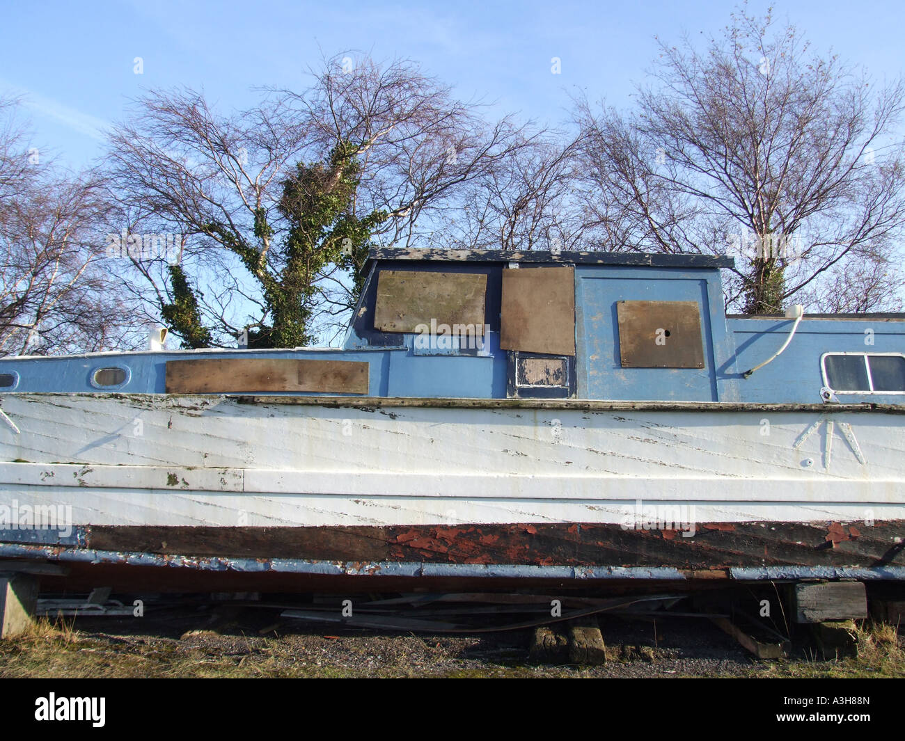 old boat left on dry land Stock Photo - Alamy