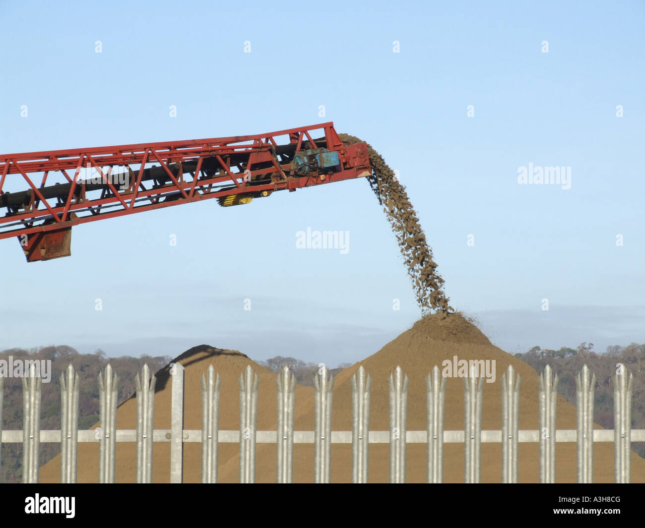 sand being transferred from ship trawler to builders yard Stock Photo ...