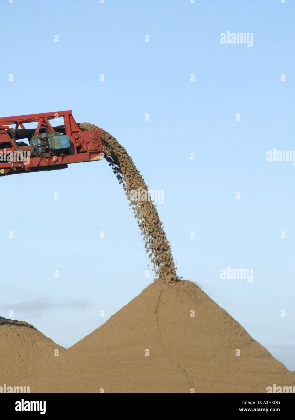 sand being transferred from ship trawler to builders yard Stock Photo ...