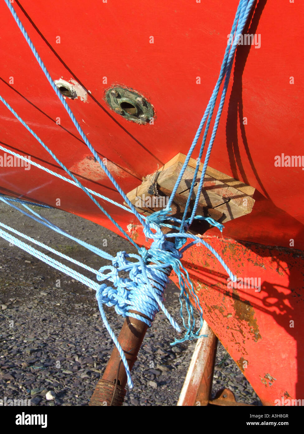 rope and stay supporting boat in dry dock for maintenance overhaul work ...