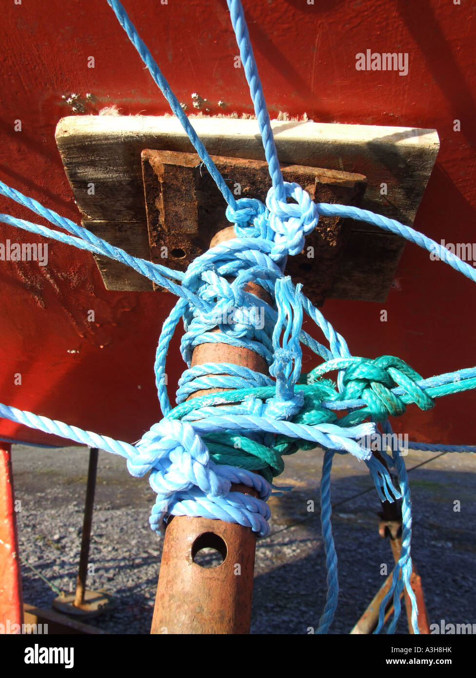 rope and stay supporting boat in dry dock for maintenance overhaul work ...