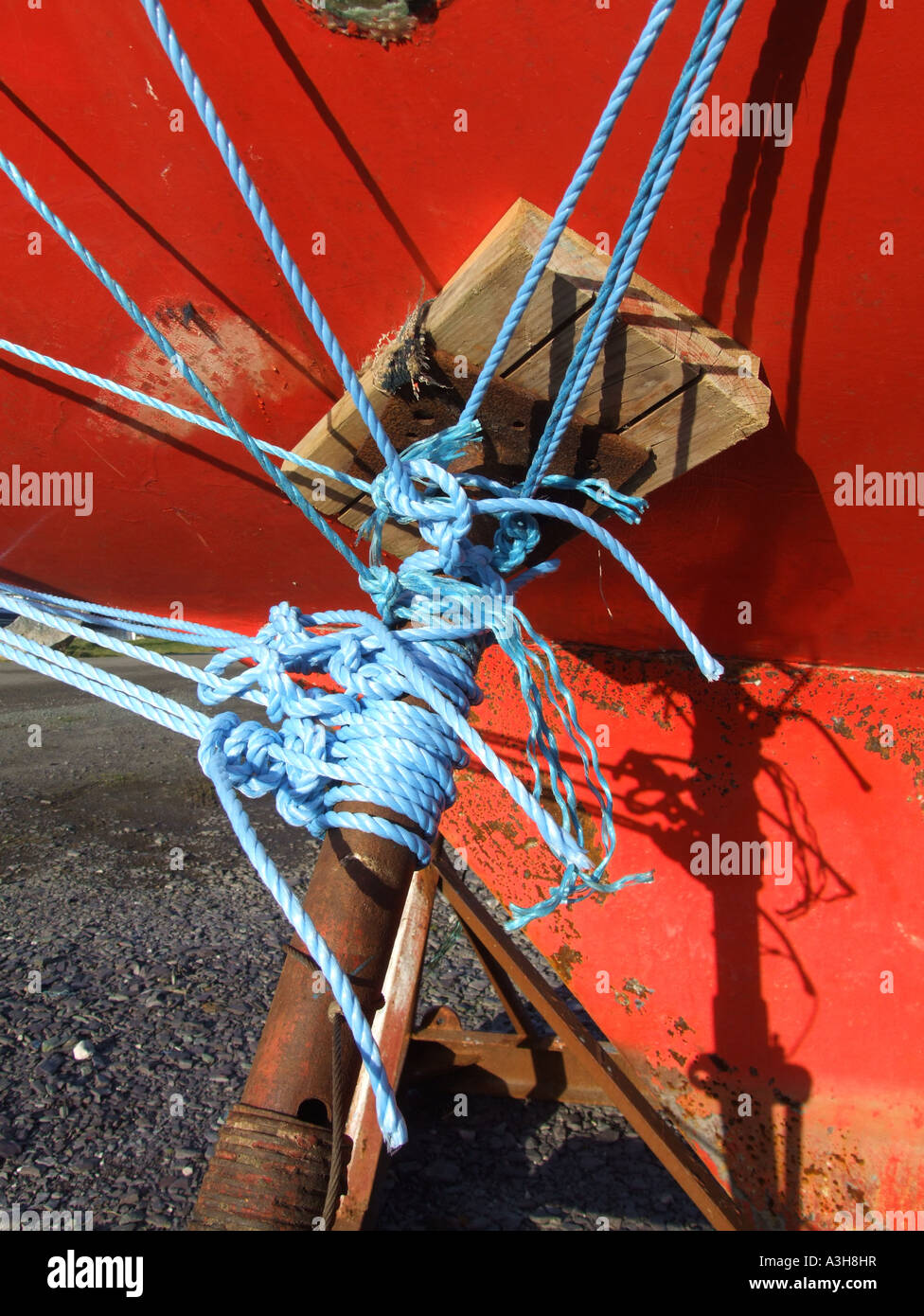 rope and stay supporting boat in dry dock for maintenance overhaul work ...