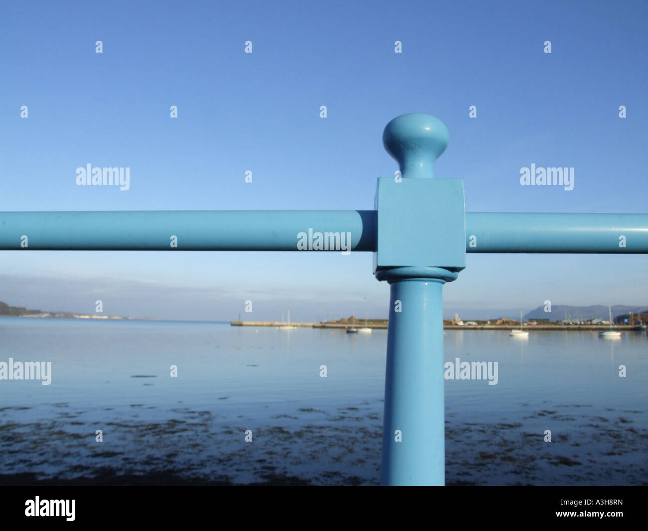 blue railings on pier by sea Stock Photo - Alamy