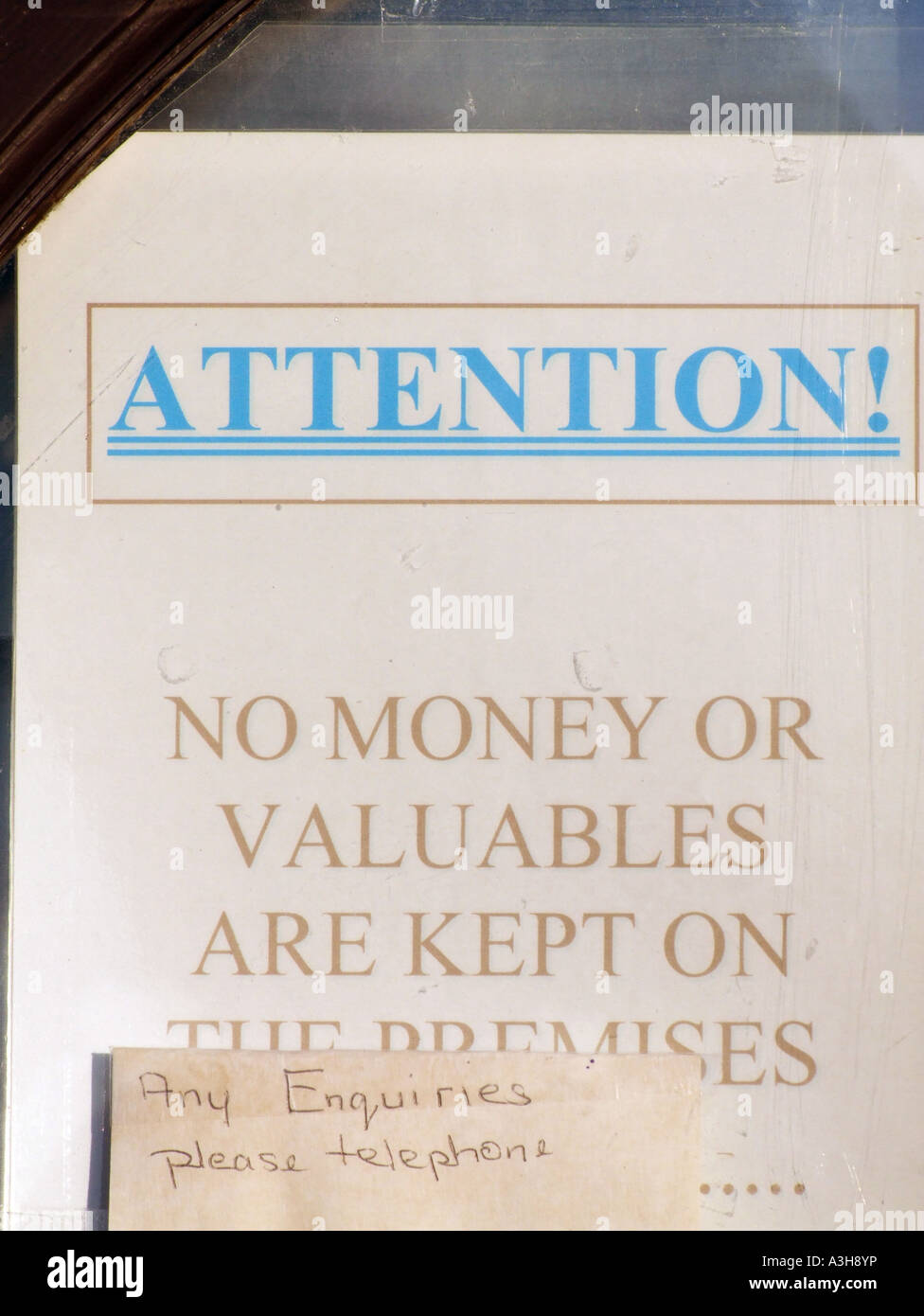 no money or valuables are kept on premises message in shop window Stock ...