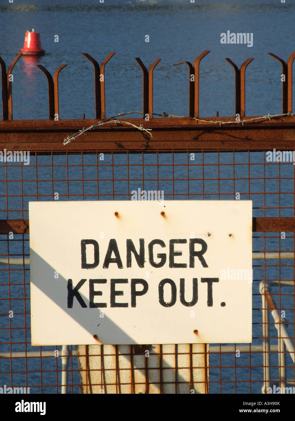 danger keep out sign by jetty Stock Photo - Alamy