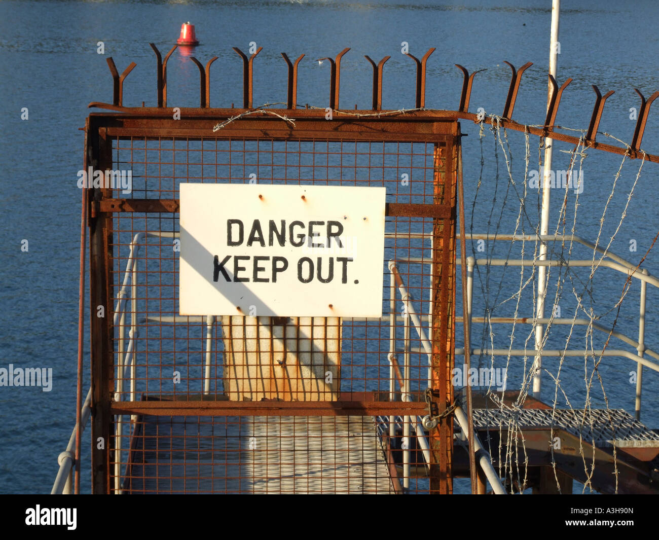 danger keep out sign by jetty Stock Photo - Alamy