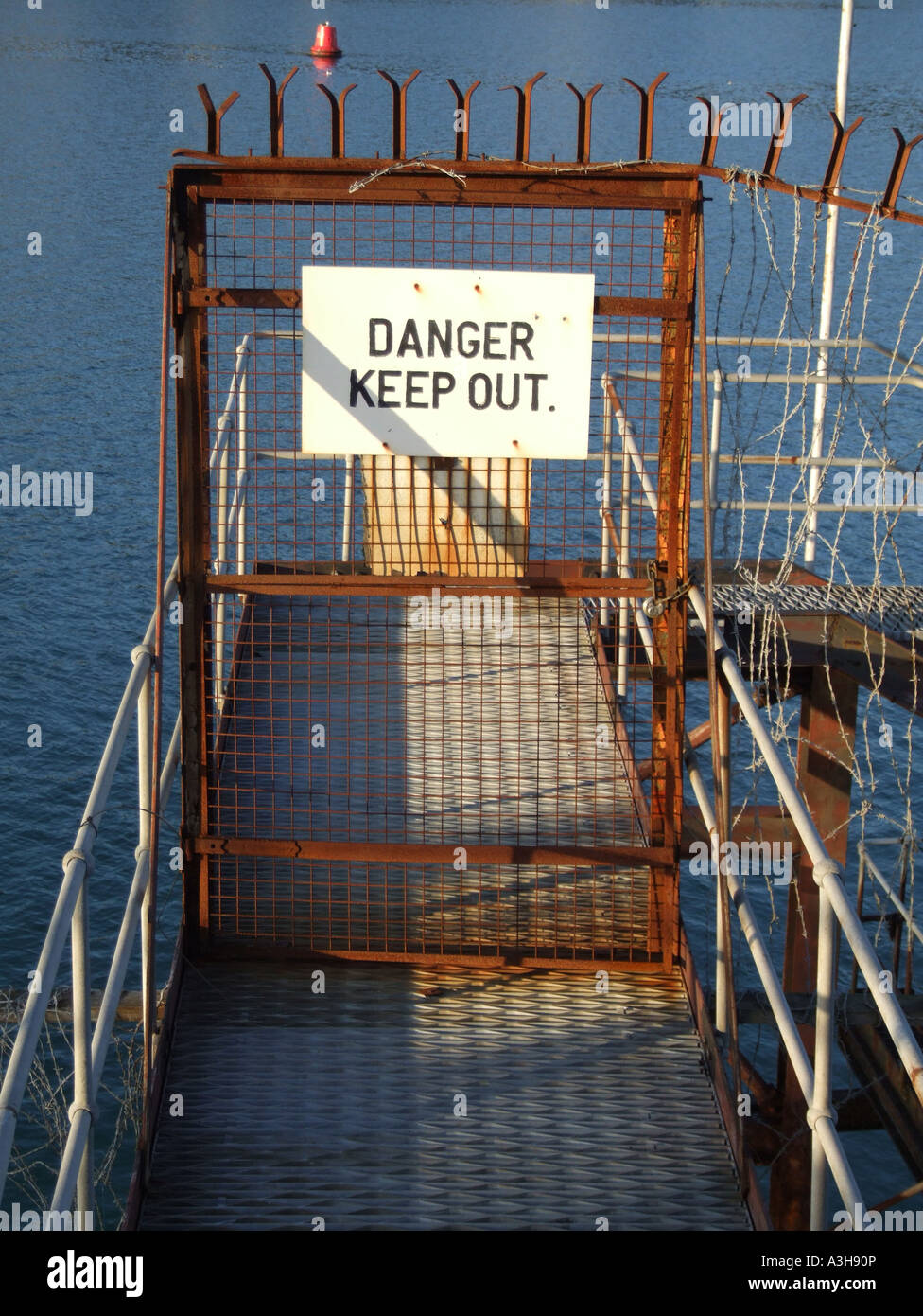 danger keep out sign by jetty Stock Photo - Alamy