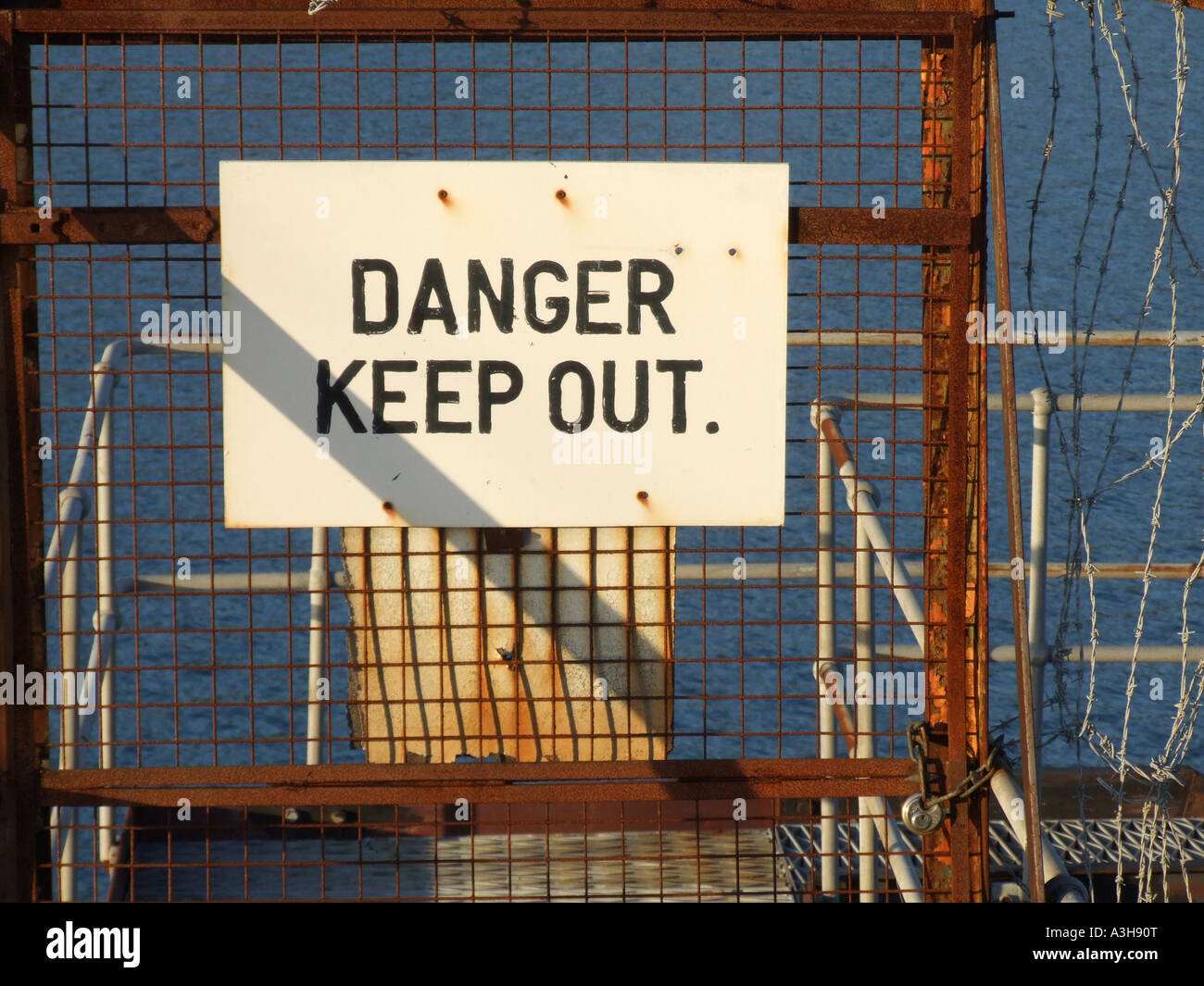 danger keep out sign by jetty Stock Photo - Alamy