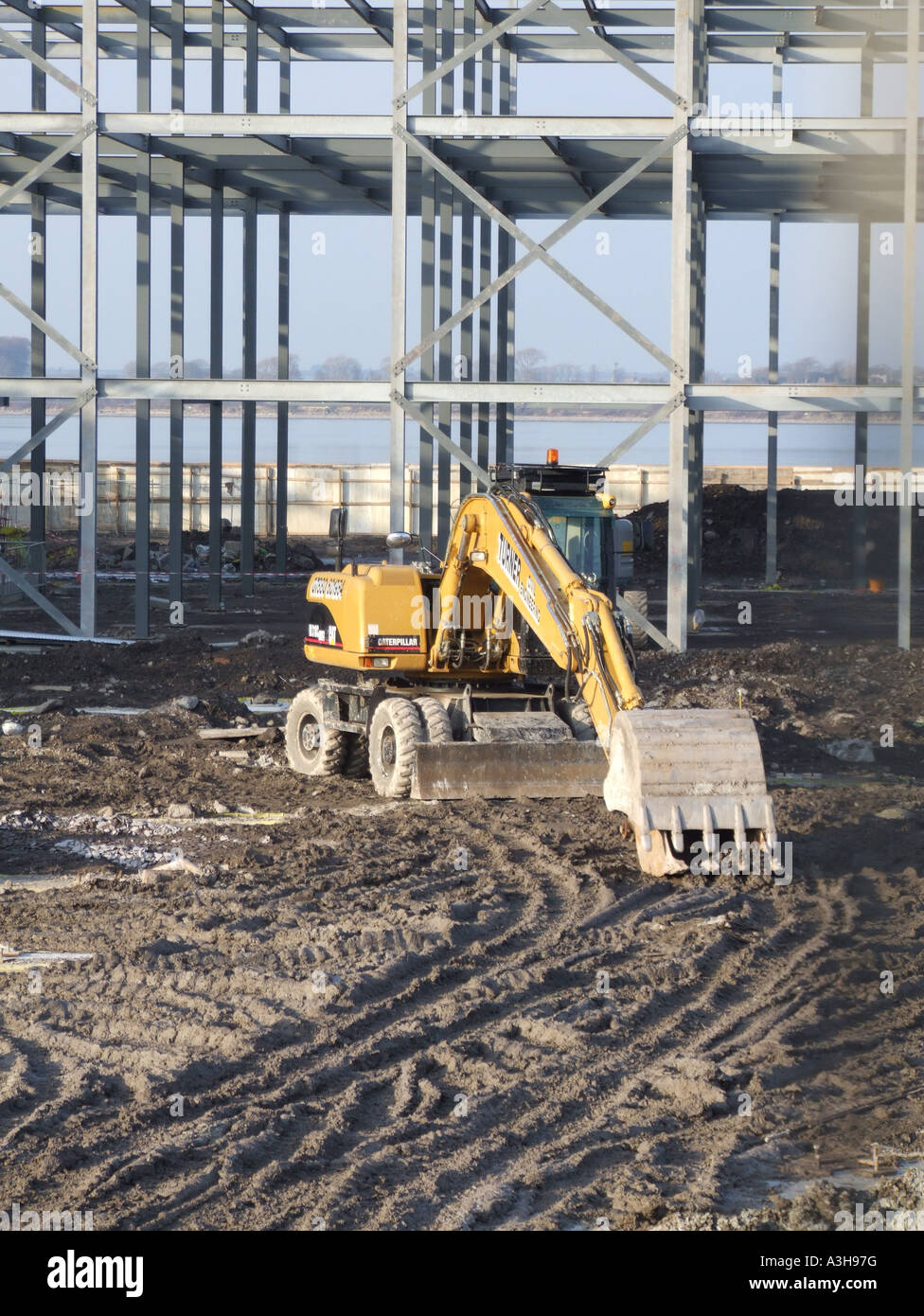 mechanical digger on building site Stock Photo - Alamy