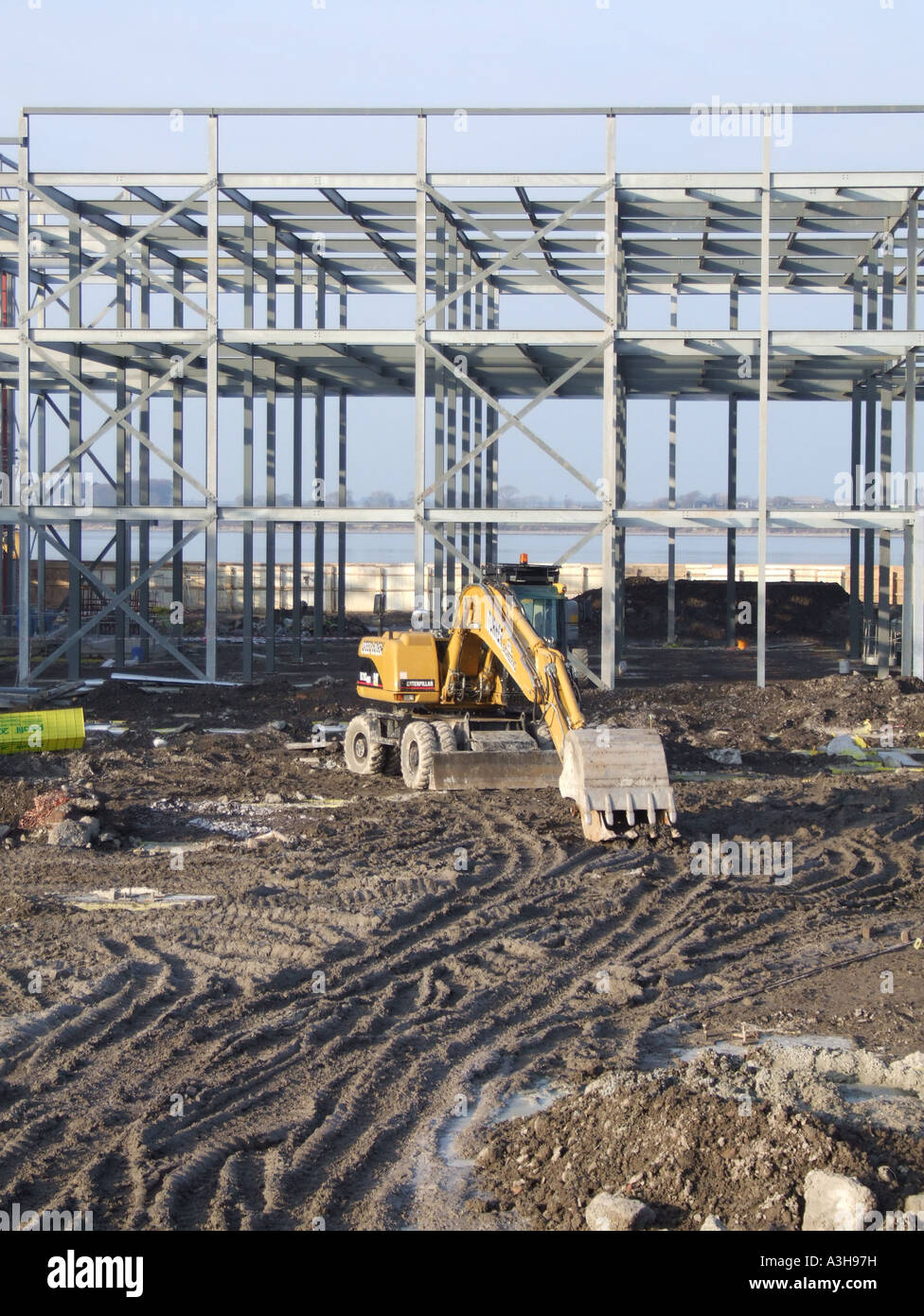 mechanical digger on building site Stock Photo - Alamy