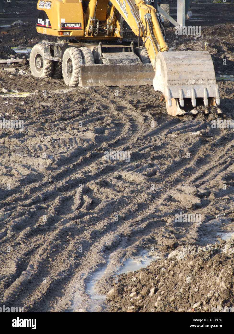 mechanical digger on building site Stock Photo - Alamy