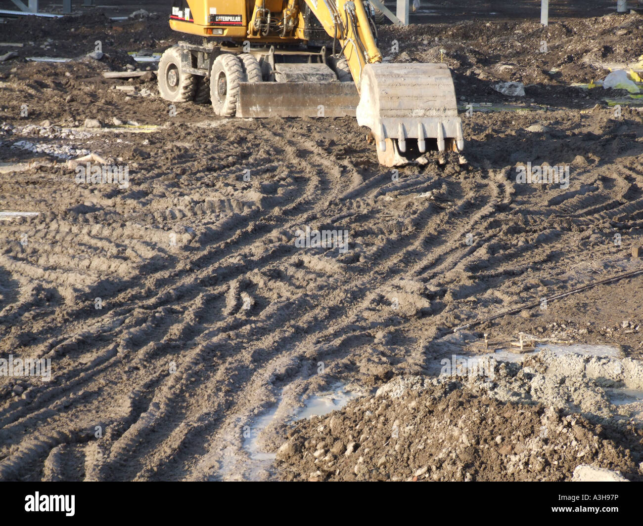 mechanical digger on building site Stock Photo - Alamy