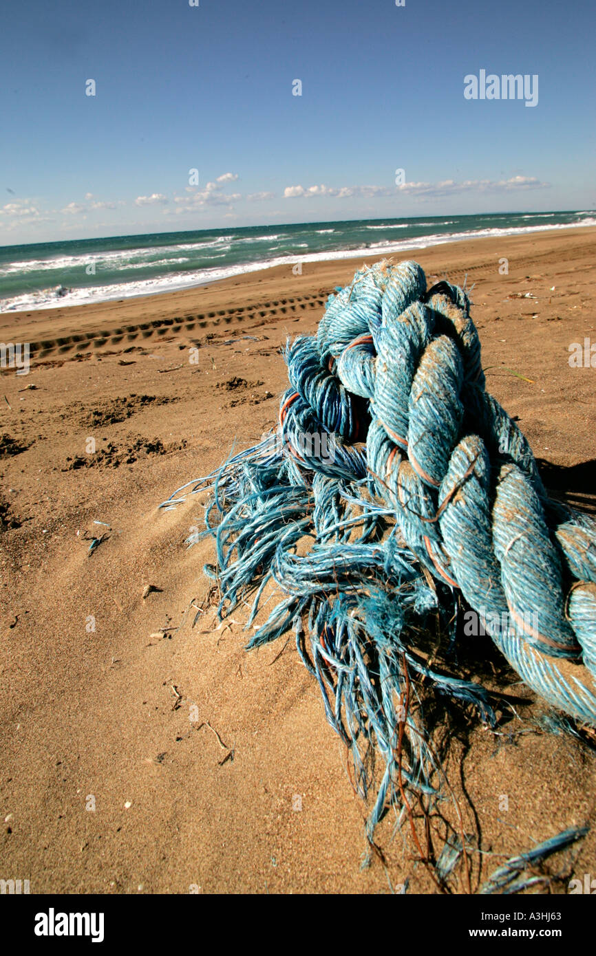 big blue rope lying at the beach at the beach of kato samiko at western ...