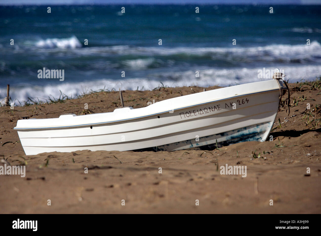 white fisher boat lying at the beach of kato samiko at the westcoast of ...