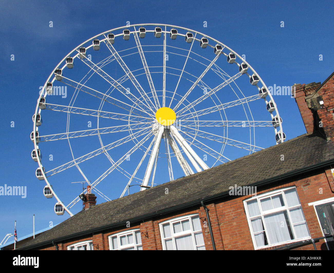 The Yorkshire Wheel peeping out from behind houses, York Stock Photo ...
