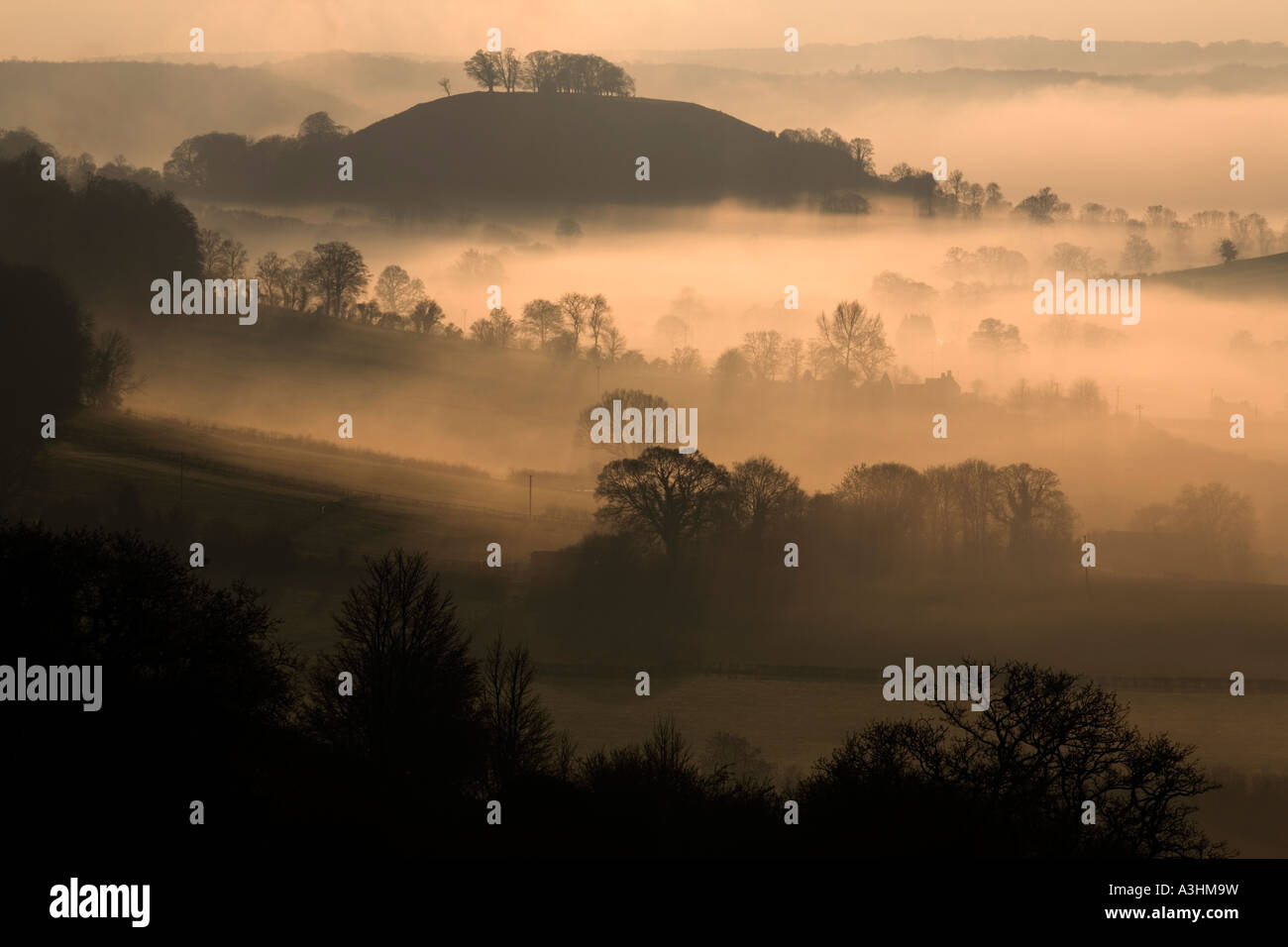 Downham Hill shrouded in mist from Coaley Peak on the Cotswold Way ...