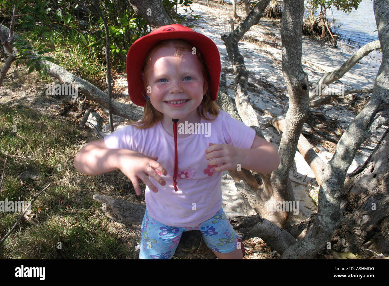 Ade 495 Happy girl with red hat Stock Photo - Alamy