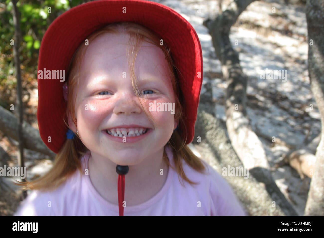 Ade 494 Happy girl with red hat Stock Photo - Alamy