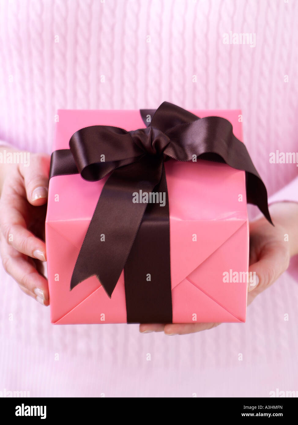 Woman's Hands Holding Present Stock Photo - Alamy