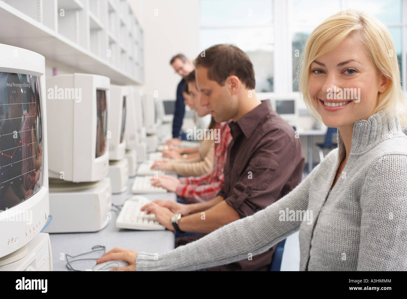 Students teacher look at computer hi-res stock photography and images ...