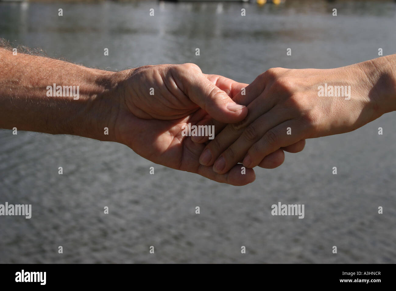 Ade 373 Hands across water Stock Photo - Alamy