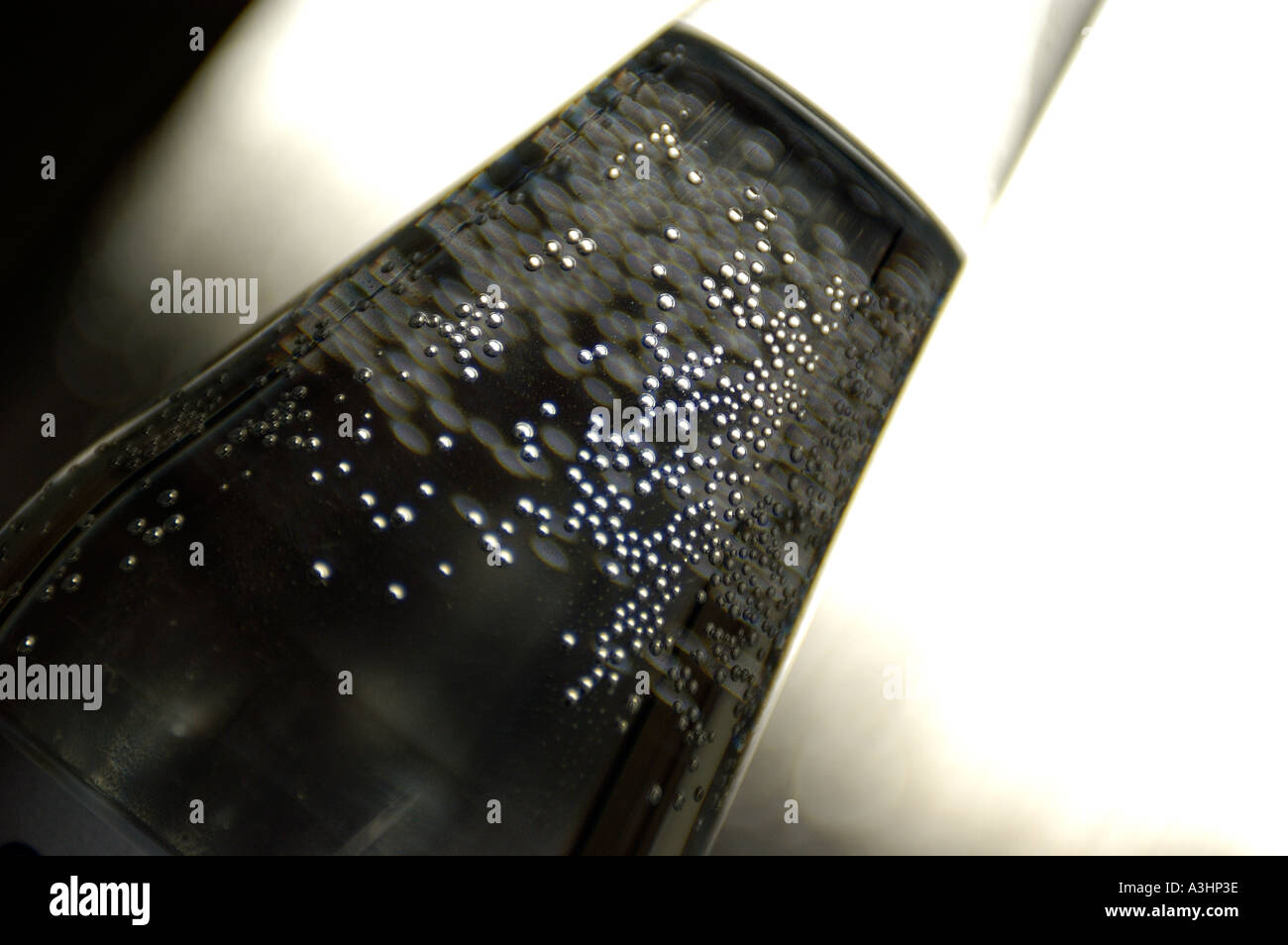 Bubbles in a bottle of soda water Stock Photo - Alamy