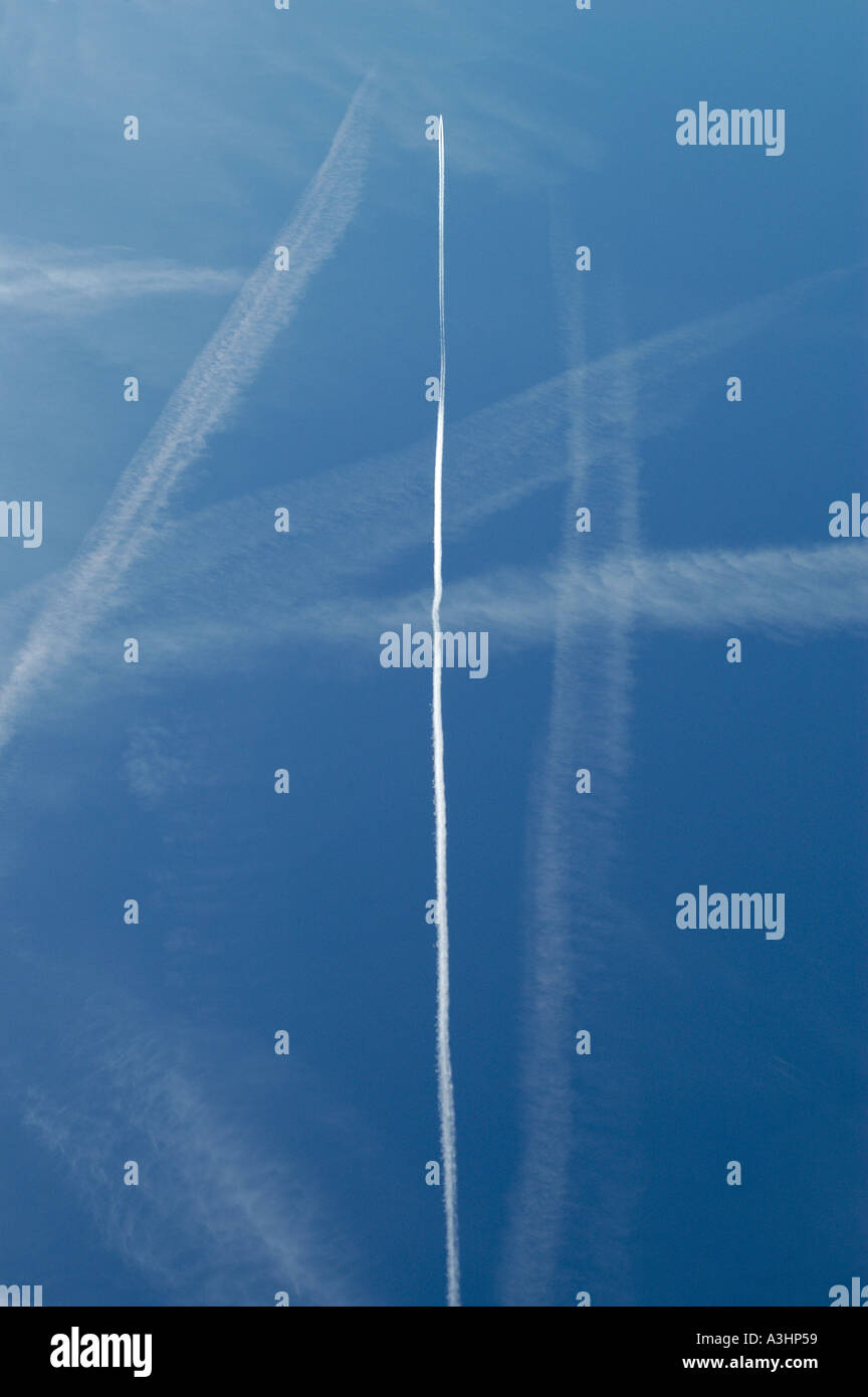 Aircraft leave white vapour trails or contrails in a blue sky Stock ...