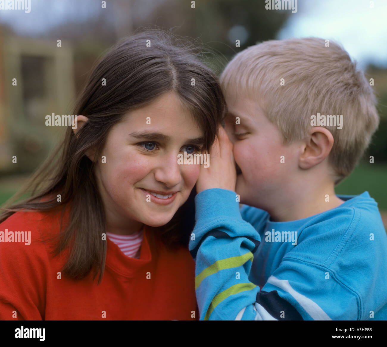 Children playing and whispering Stock Photo - Alamy