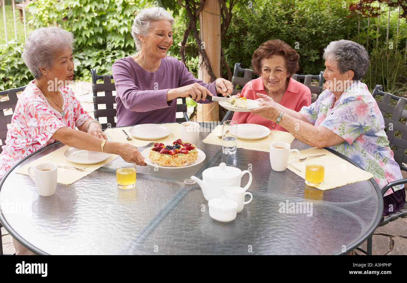 Diverse group of people eating outside hi-res stock photography and ...