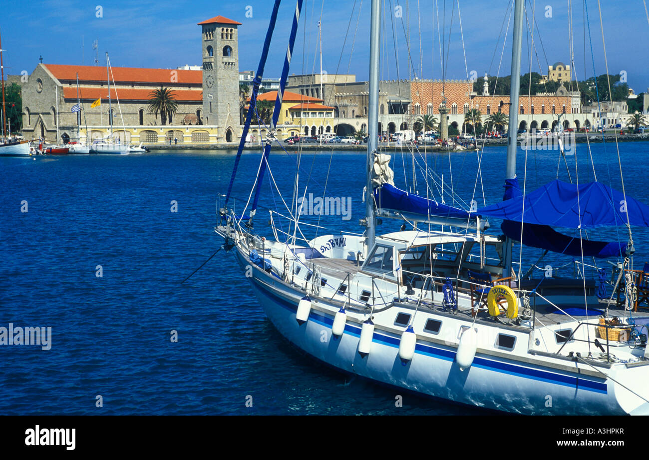 sailing boats at Mandraki Harbour of Rhodes Town with the protestant ...