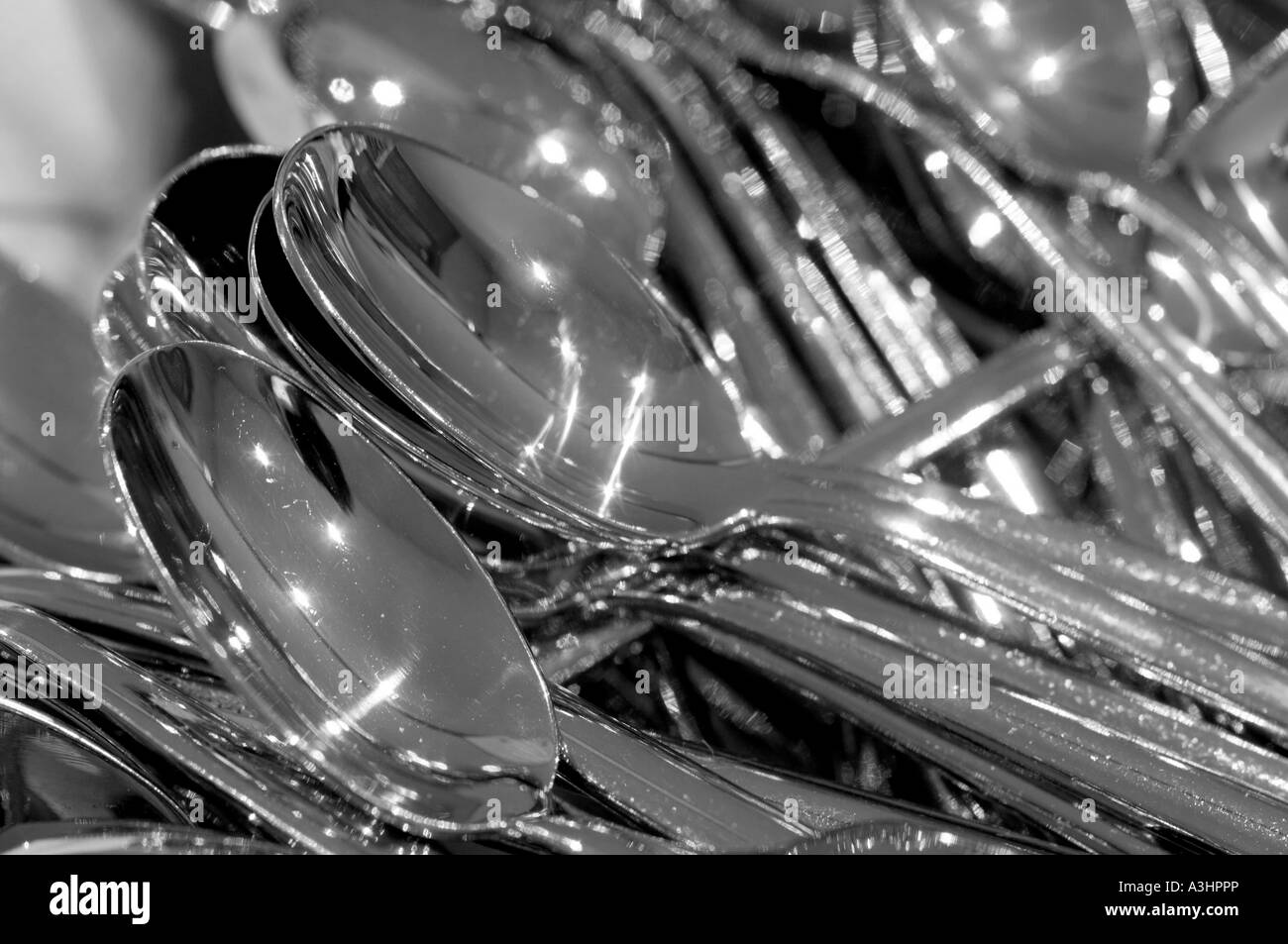 A pile of metal spoons in a restaurant Stock Photo - Alamy