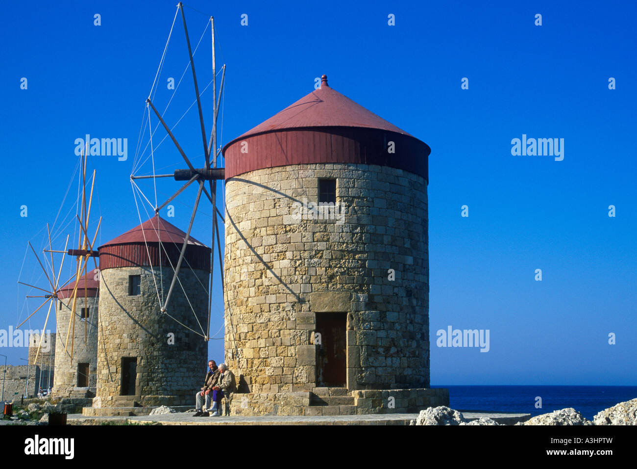 old windmills at Mandraki Harbour in Rhodes Town Stock Photo - Alamy