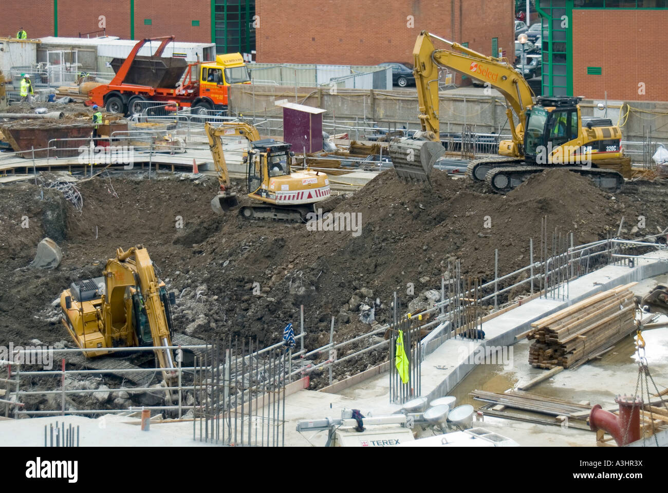 Excavators digging foundation construction site hi-res stock ...