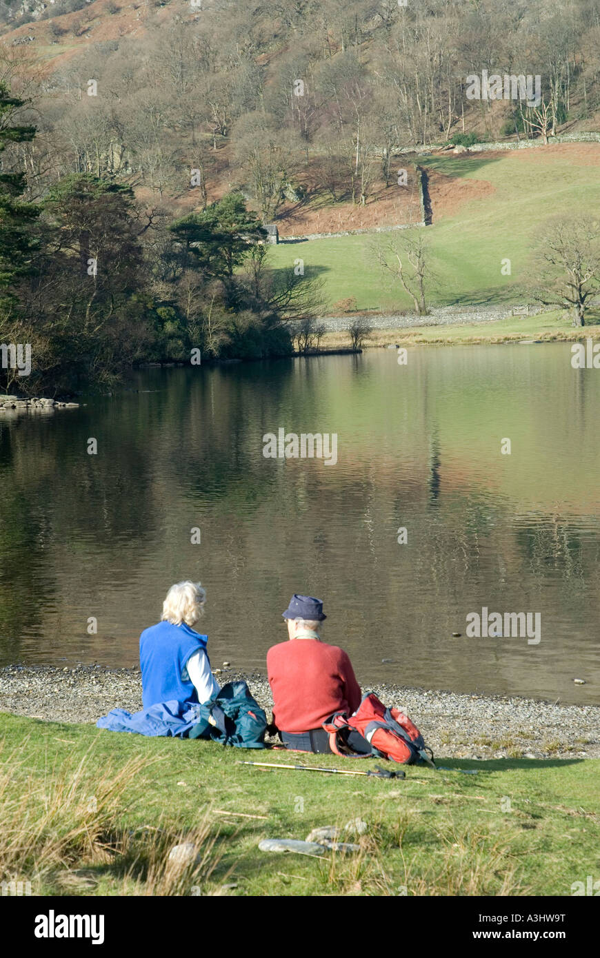 Elderly couple sat overlooking Rydal Water in the Lake Distict Stock ...