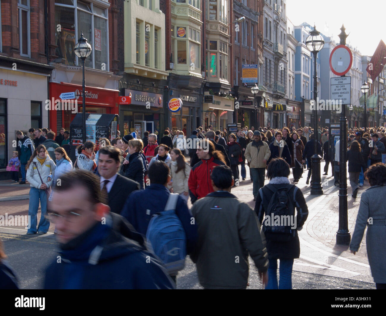 Busy crowded street scene, shopping in Graften Street, Dublin, Ireland ...